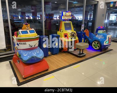 Coin operated amusement kiddie rides Stock Photo - Alamy