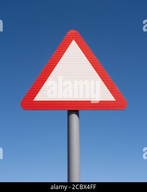 Red blank triangular road sign and blue sky Stock Photo - Alamy