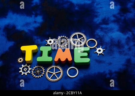 Colorful time wording with gears as time concept Stock Photo - Alamy