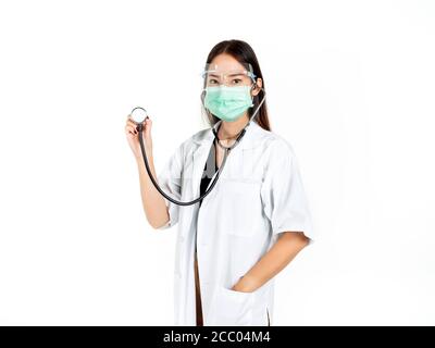 Friendly doctor in face shield looking inside woman mouth Stock Photo ...