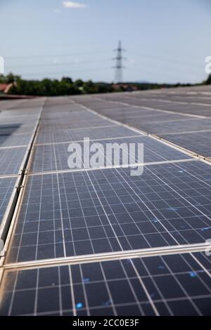 Solar panels overlooking city area Stock Photo - Alamy