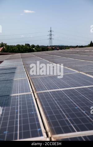 Solar panels overlooking city area Stock Photo - Alamy