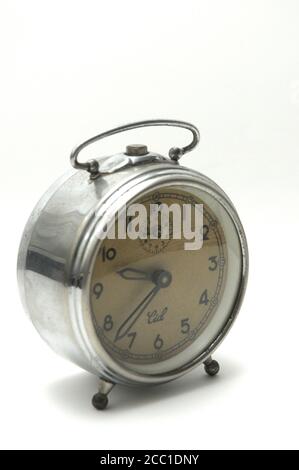 vintage alarm clock showing almost twenty to ten Stock Photo - Alamy
