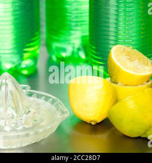 Lemon, lemon juice in peel and lemon squeezer Stock Photo - Alamy