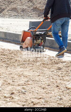 Vibratory plate compactor in construction rammer ground compaction of ...