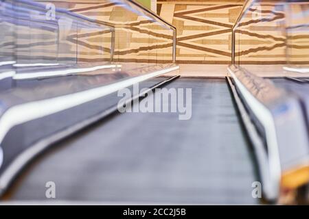 Moving walkway in shopping center. Horizontal slow-moving conveyor ...
