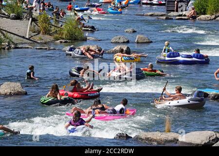 Tourists utilizing the Deschutes River in Bend, Oregon, during the ...