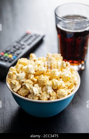 A closeup shot of a black TV remote control isolated on a white ...
