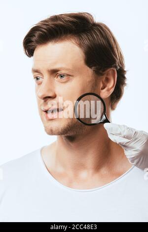 Doctor with magnifying glass on white background Stock Photo - Alamy