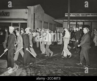 Zoot Suit Riots in Los Angeles. Police examine the draft credentials of ...
