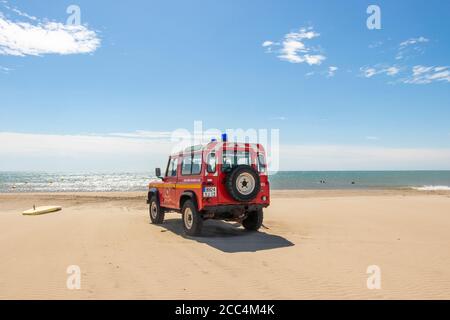 red Coastguard Land Rover defender at place Napoleon beach in the ...