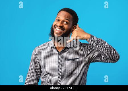 young man with cellphone doing funny faces isolated in white Stock ...