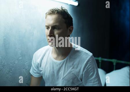 Portrait of tired unhappy young dark skinned manager sitting at ...