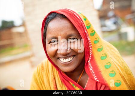 Close-up portrait of a smiling Bihar woman against white background ...