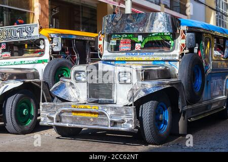 MANILA, PHILIPPINES - FEBRUARY 24, 2013: Jeepneys are popular public ...