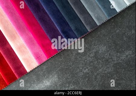 Color gradients of velvet samples on fabric swatch placed on a dark ...