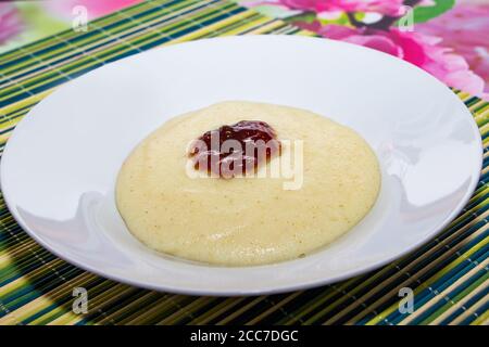 Semolina with jam on a green bamboo background Stock Photo - Alamy