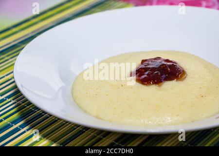 Semolina pudding with jam. Traditional dessert. Food UK Stock Photo - Alamy