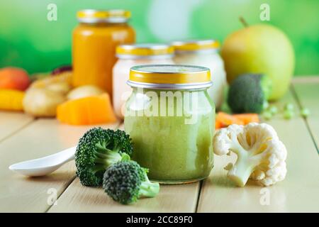 Jar with vegetable puree on the light wooden background Stock Photo - Alamy