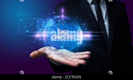 Man hand holding EDGE COMPUTING inscription, technology concept Stock ...