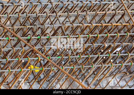 Rusty steel threaded rods bars with yellow protection caps. Covers ...