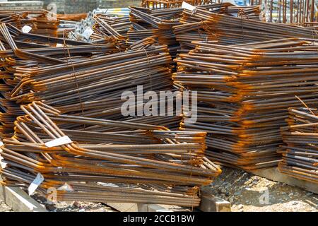 Ligatures for reinforcing footing beams background. Pile of reinforcing ...