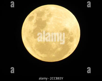 Golden planet with white blue star in deep black space Stock Photo - Alamy