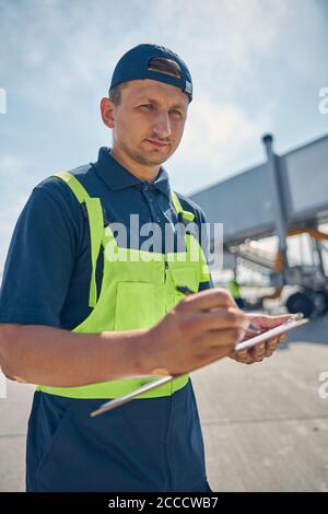 Ground Crew Worker Man Standing and Marshalling Directing an Aircraft ...