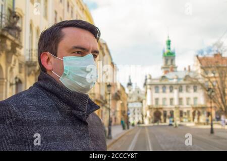 Handsome hispanic man wearing ukraine flag smiling happy pointing with ...