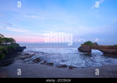 A scenic view of the Pura Batu Bolong temple in the Tanah Lot in the ...