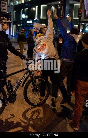 Seattle, USA – Jan 29, 2017: An angry man with a pipe confronting Anti ...