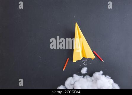 Paper plane on a blackboard with cotton wool smoke Stock Photo - Alamy