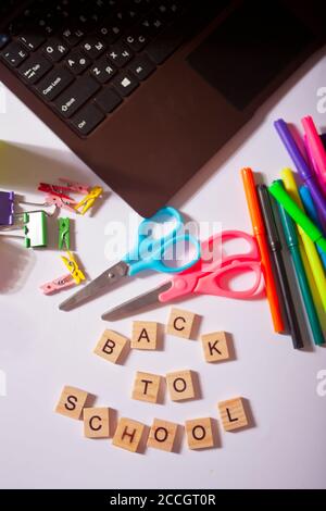School supplies, pumpkin, autumn leaves and text back to school on the ...