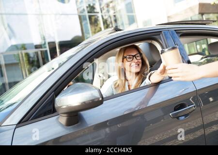 Woman behind steering wheel of modern car Stock Photo - Alamy