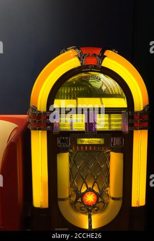 Vintage American music jukebox with illuminated buttons, process of ...