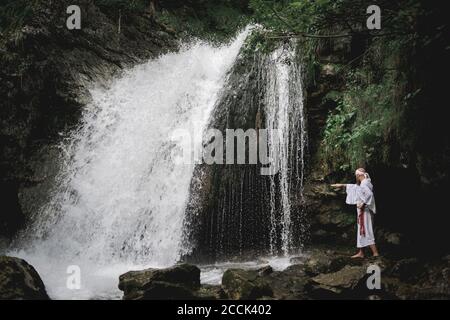 European yamabushi monk doing takigyo waterfall meditation Stock Photo ...