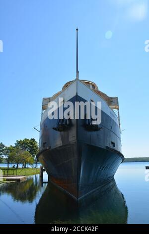 Old Great Lakes freighter at rest in small pier on Manitoulin Island ...