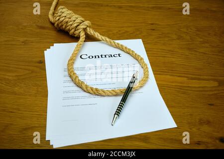 Contract with pen and rope tied in hangmans noose. Strangulation ...