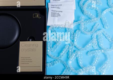 Invisalign transparent brackets package box on blue background and ...