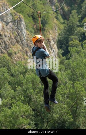 Riding the zip line Stock Photo - Alamy