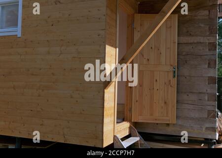 Brand new addition to the wooden house, outdoor shot Stock Photo - Alamy