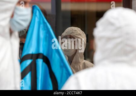 Members of Extinction Rebellion are dressed in costumes during a ...