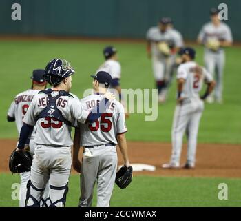 Minnesota Twins pitcher Taylor Rogers, top, looks on as first baseman ...