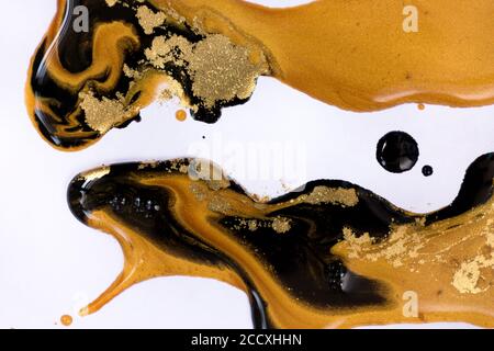 Black and gold mixed inks ripples background Stock Photo - Alamy