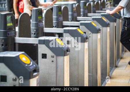 Selective focus, automatic ticket barriers at London Paddington rail ...