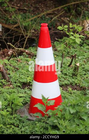 Close up shot of a cone signal on the ground Stock Photo - Alamy