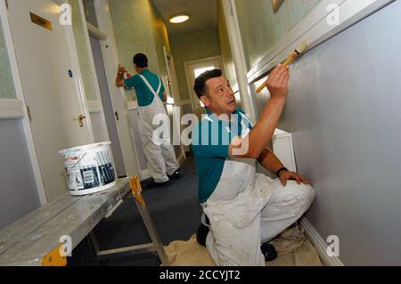 Painters & decorators painting old NHS building Yorkshire UK Stock ...