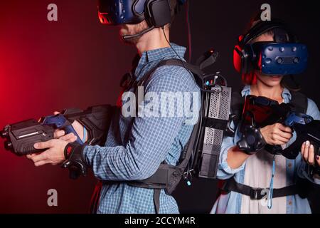 Lovely couple playing vr game as team, fighting. Wearing casial clothes ...