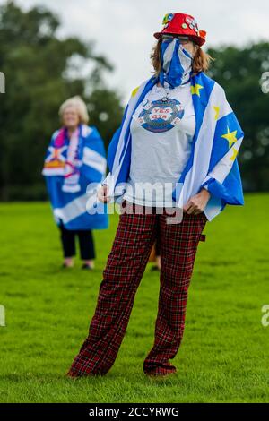 All under one banner hold a socially distanced protest about land ...