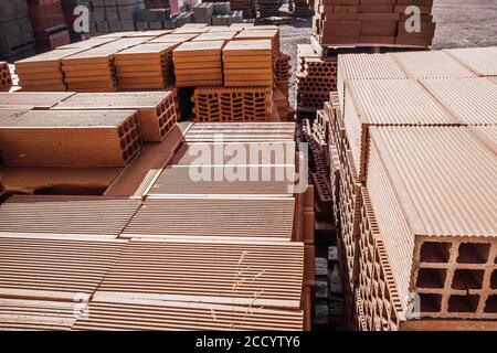 Pile of new bricks stacked to build a wall in a building supplies store ...